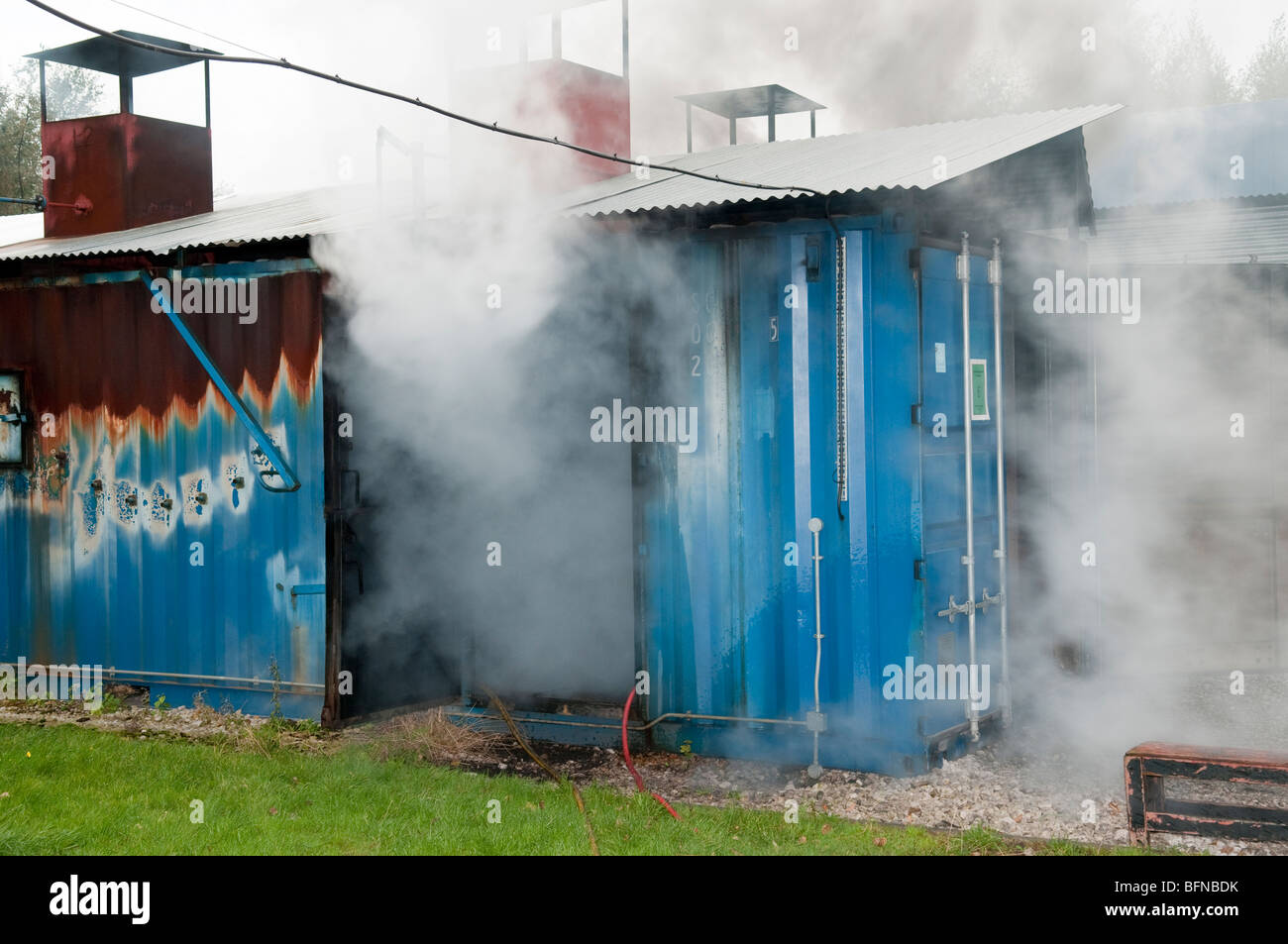 Fire training rig with smoke issuing Stock Photo - Alamy