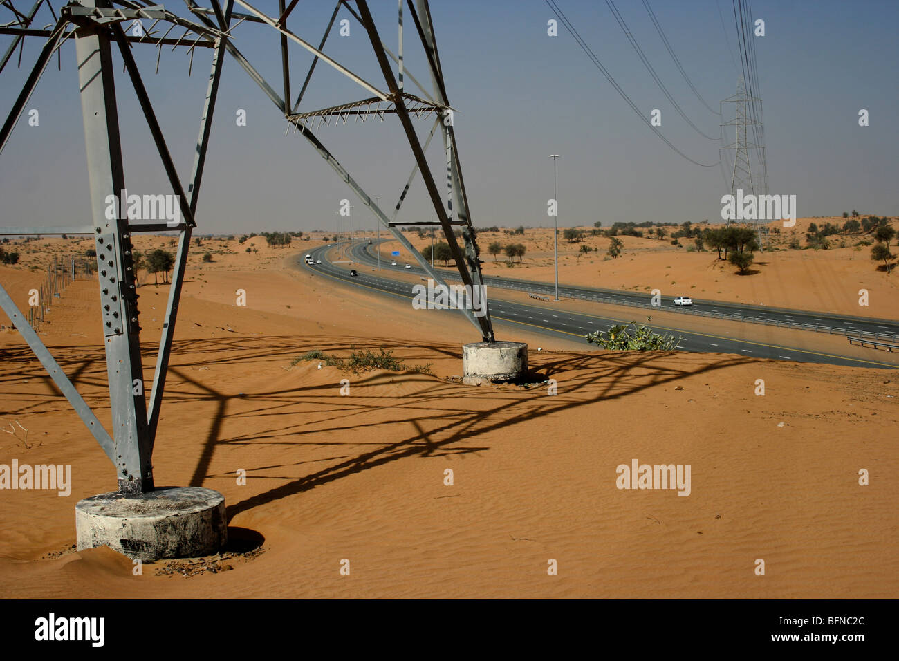 Power transmission lines in the desert uae Stock Photo - Alamy