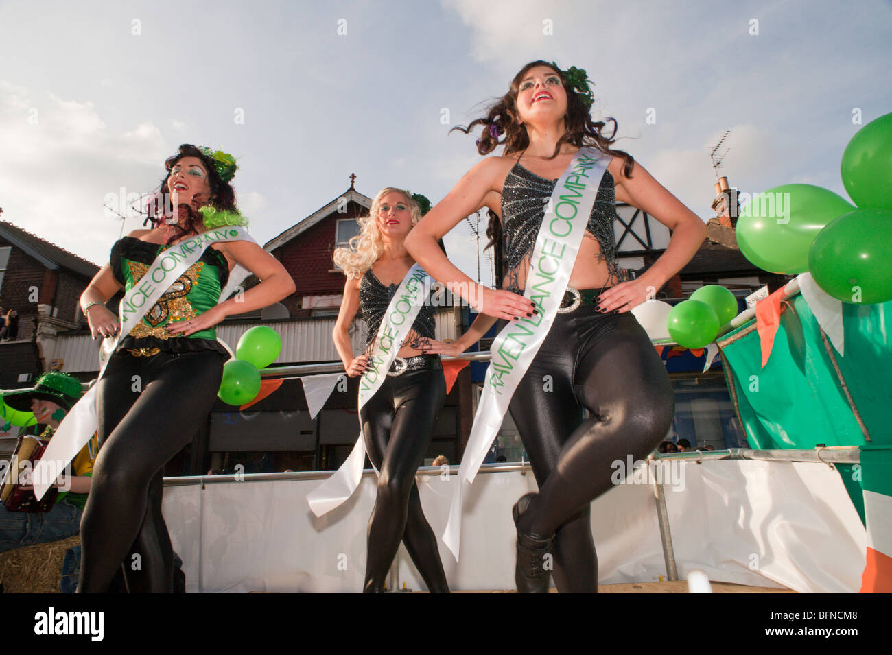 Young women dancing on float in Brent St Patrick's Day Parade. Raven ...