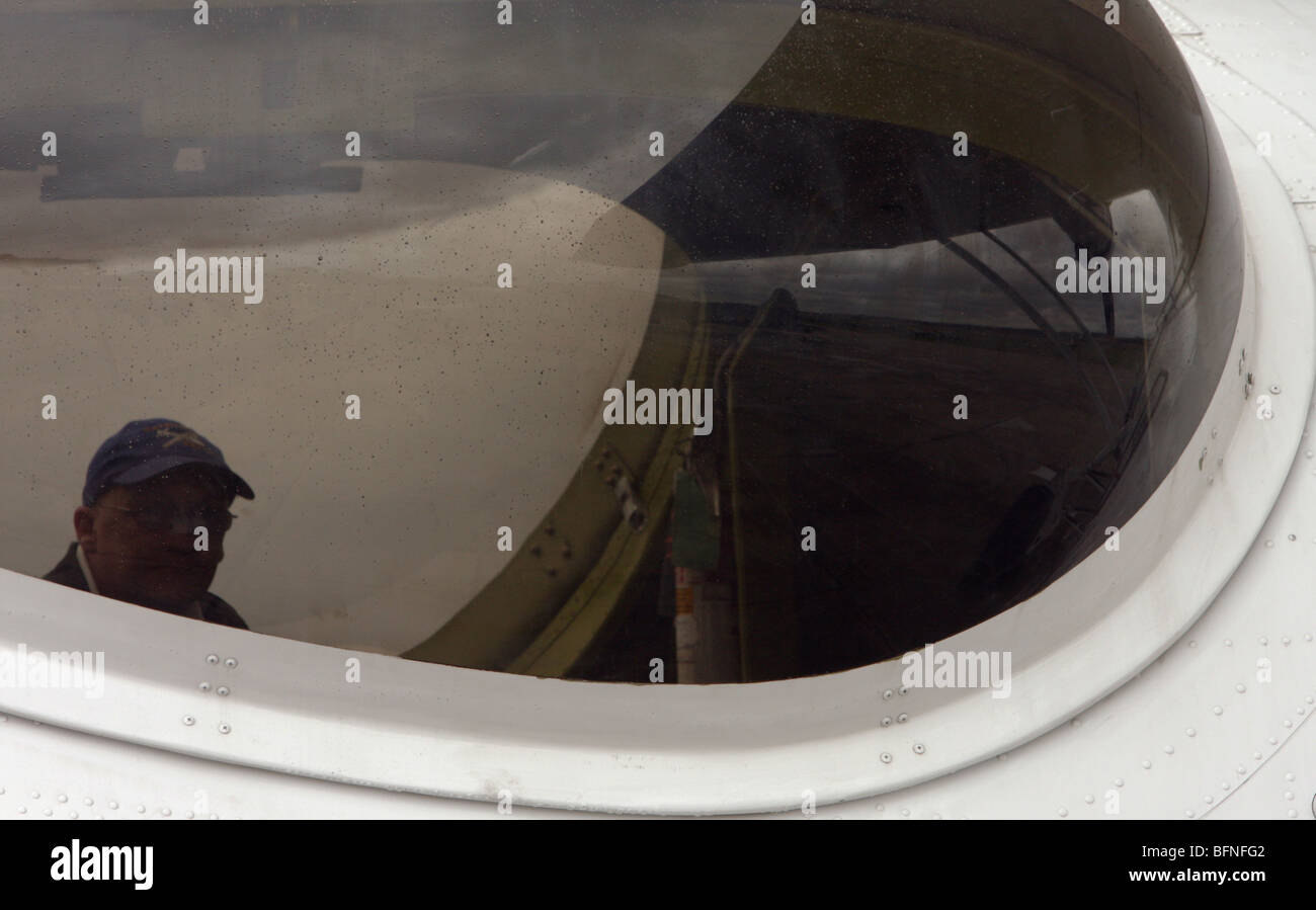 A man sitting an a PBY Catalina looks out of the blister window Stock ...