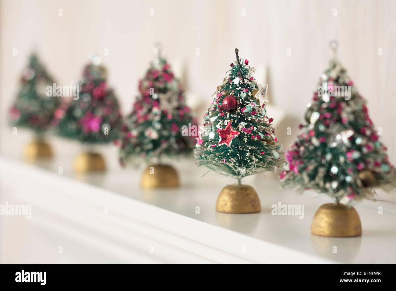 Mantle of Christmas Trees Stock Photo - Alamy