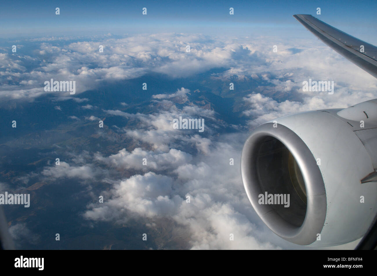 View from plane window flying over French Alps. Showing engine and wing ...