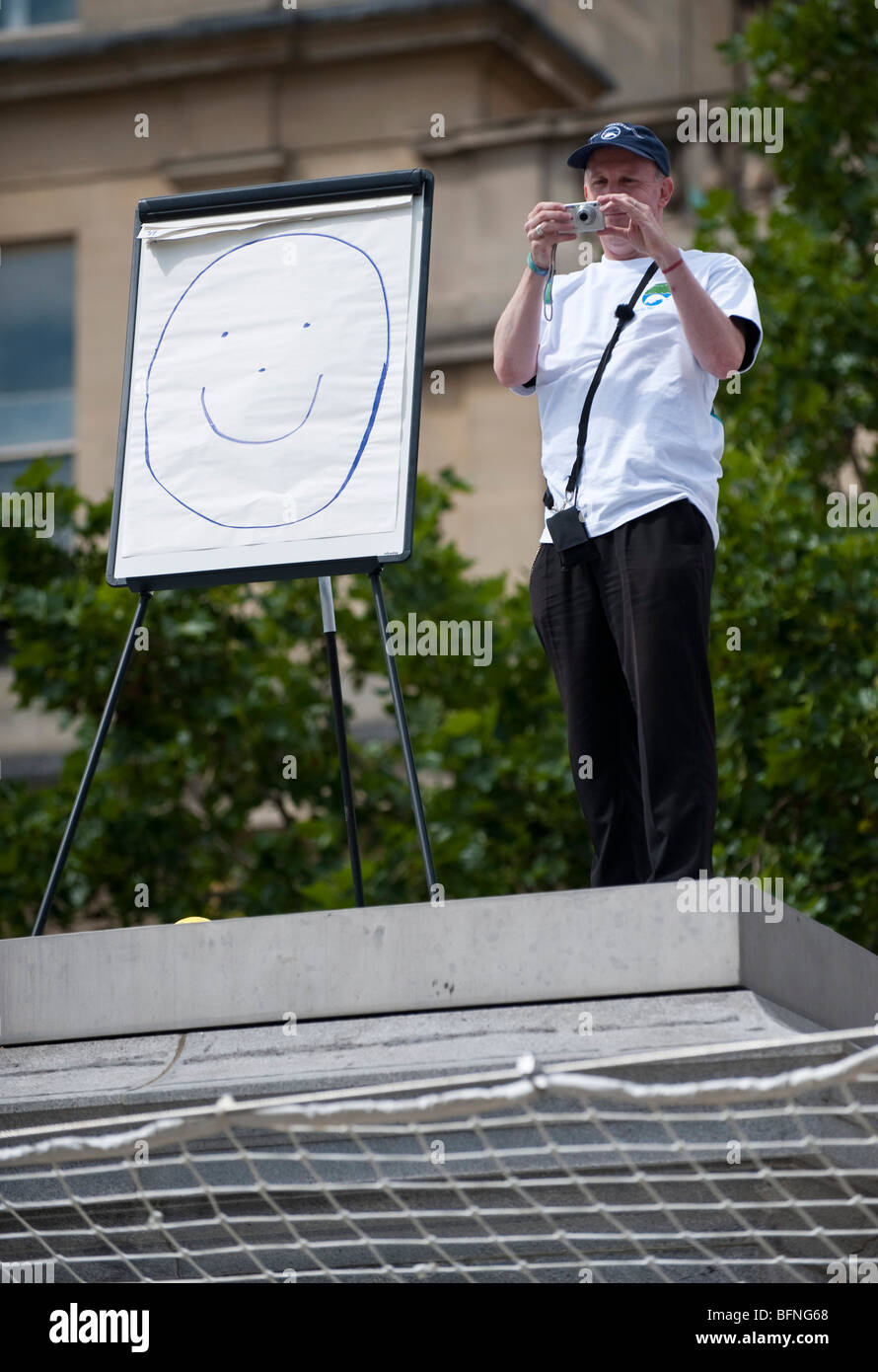 A man holding a banner as part of Antony Gormley's Fourth Plinth ...