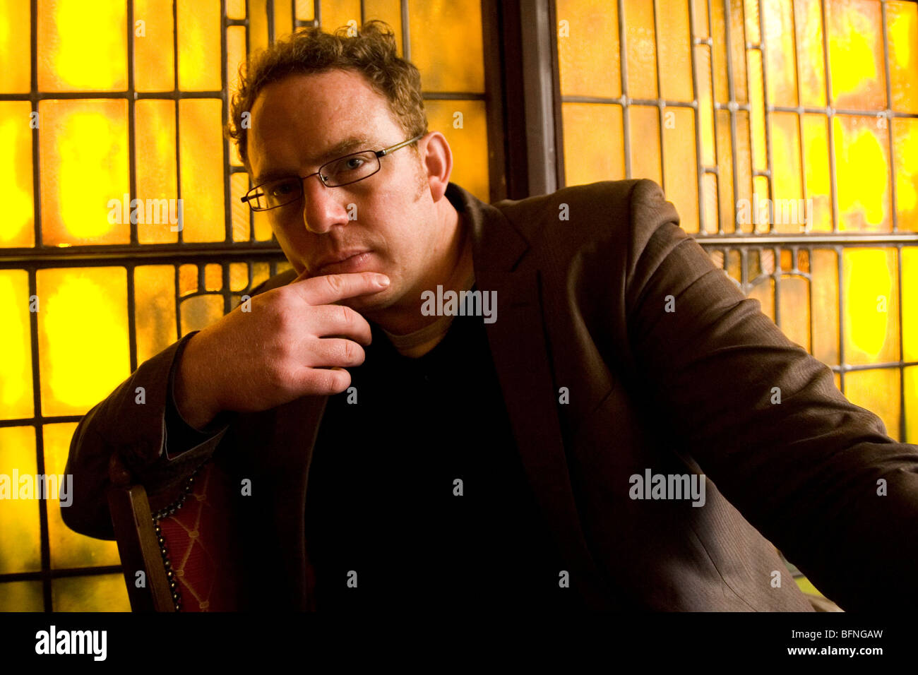 A red haired man sits thoughtfully in a cafe in the Dutch city of Breda ...