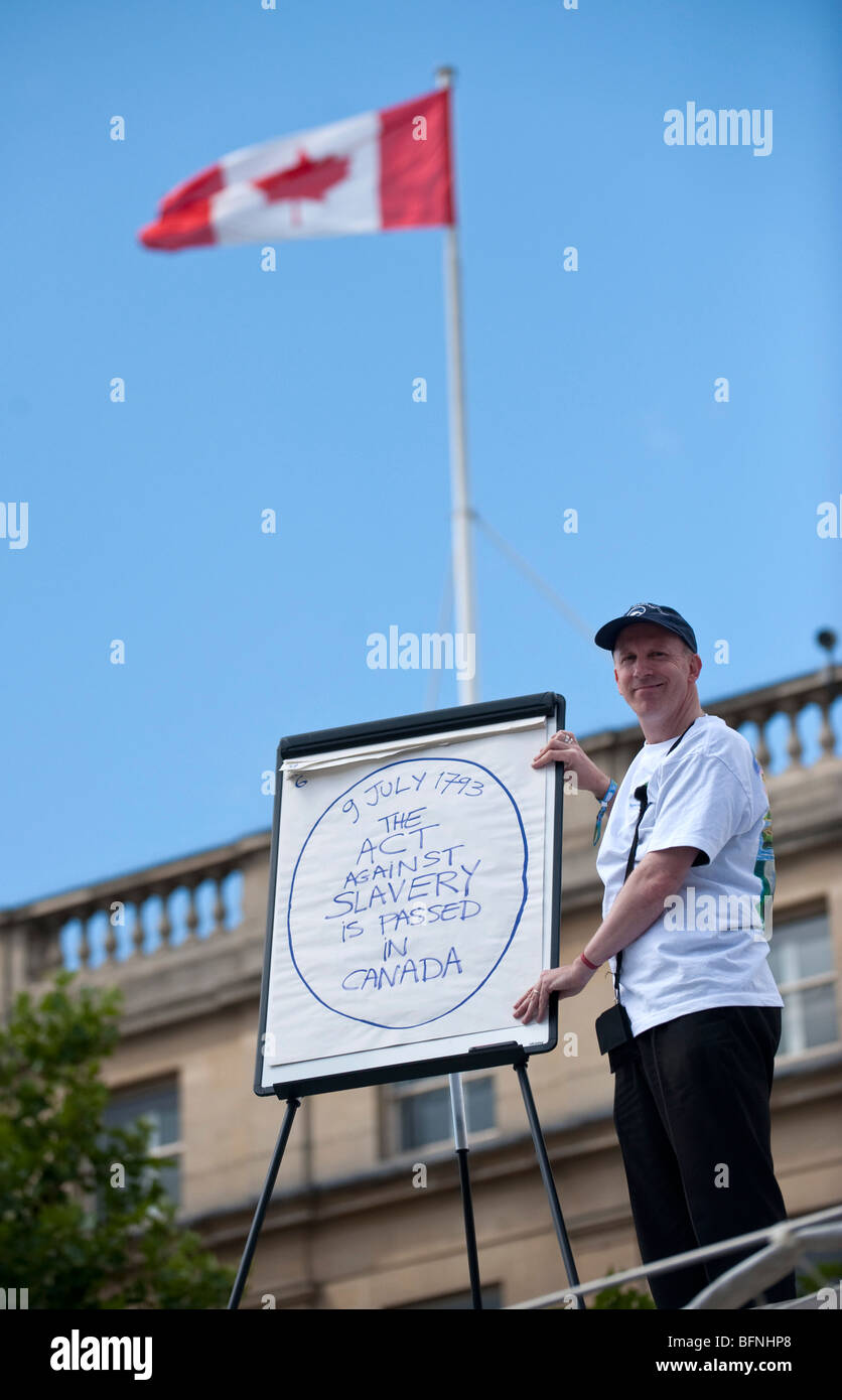 A man holding a banner as part of Antony Gormley's Fourth Plinth ...