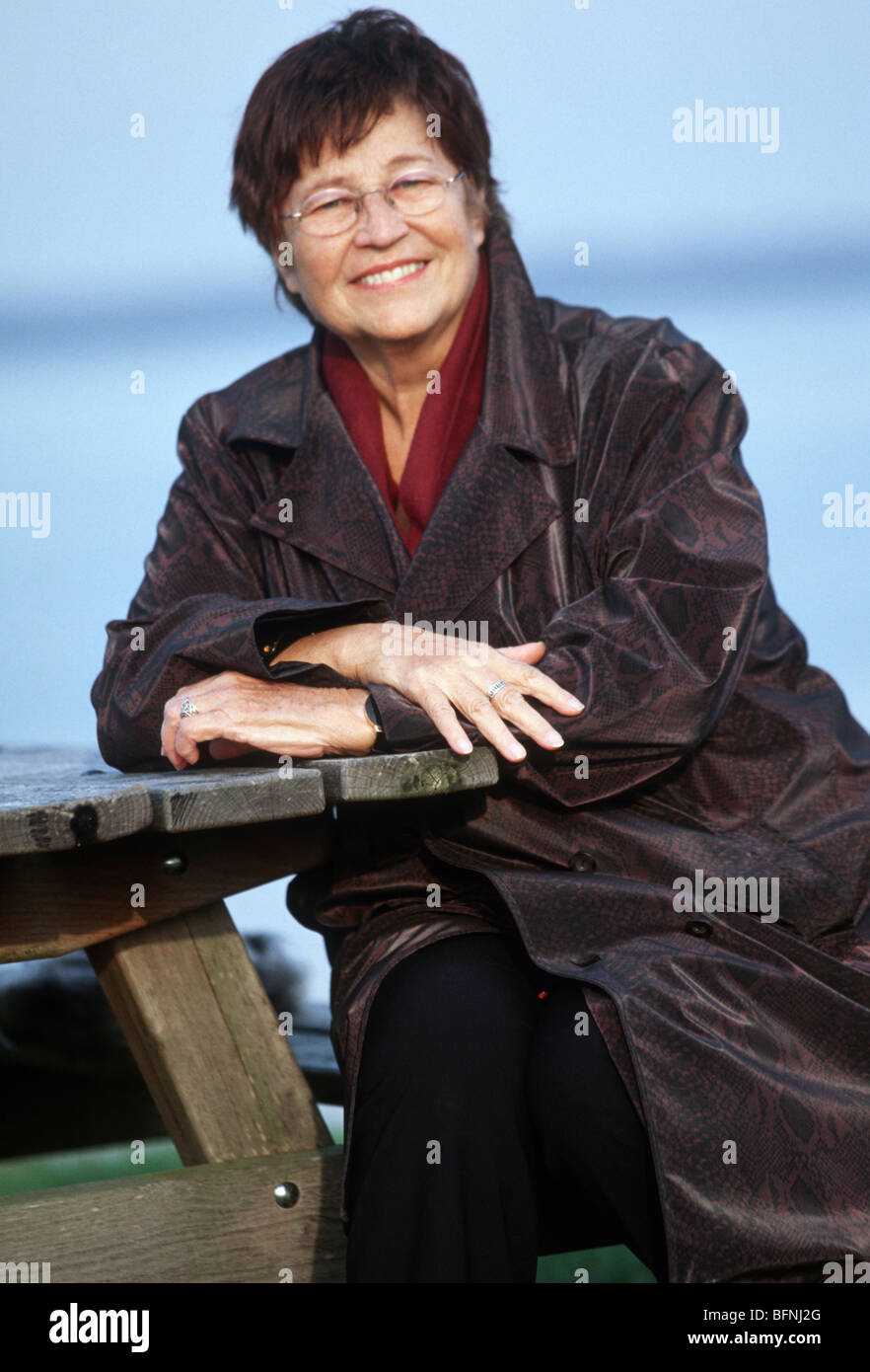 Old woman sitting bench facing camera hi-res stock photography and ...