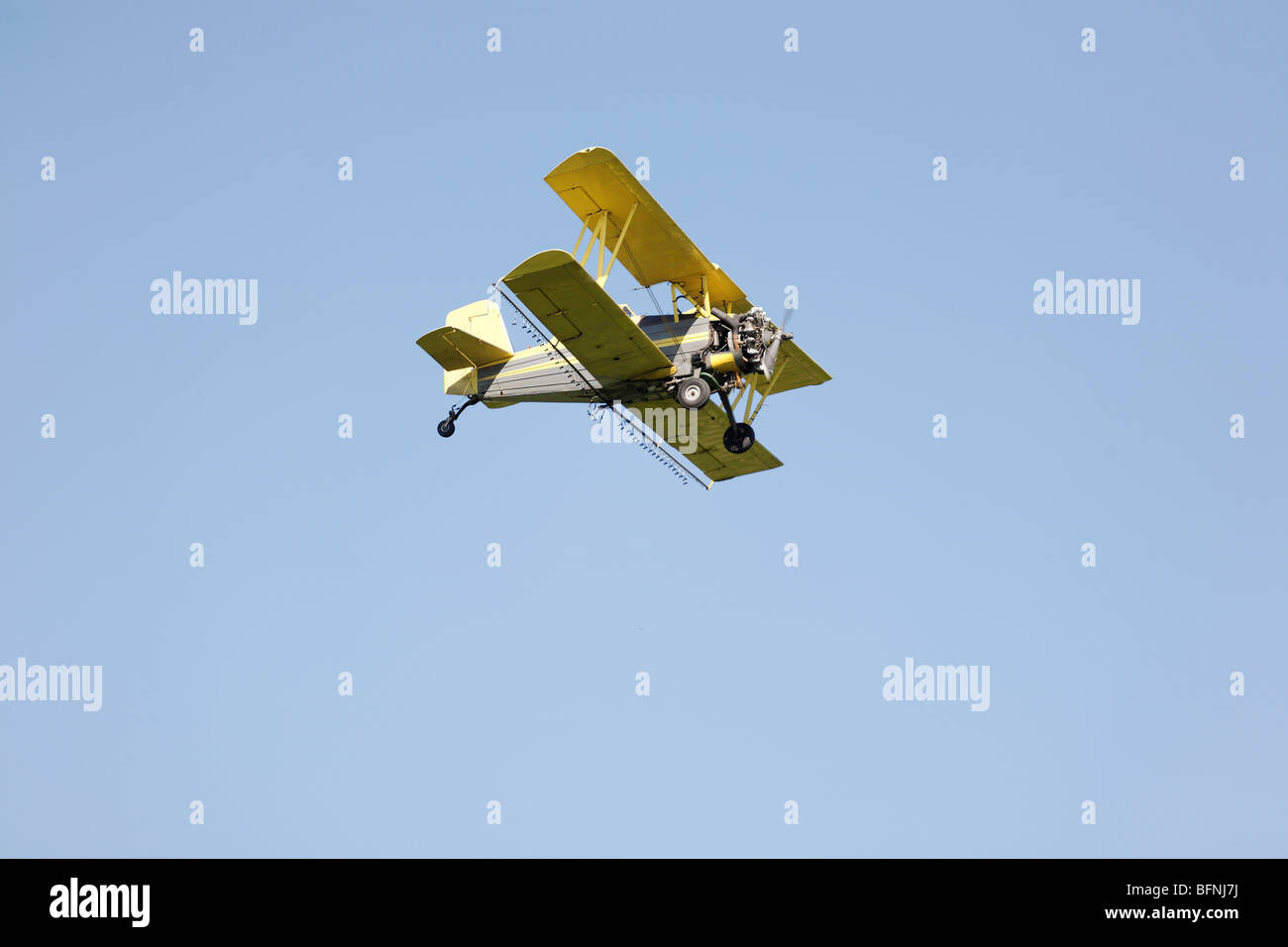 Yellow biplane, crop duster Stock Photo - Alamy
