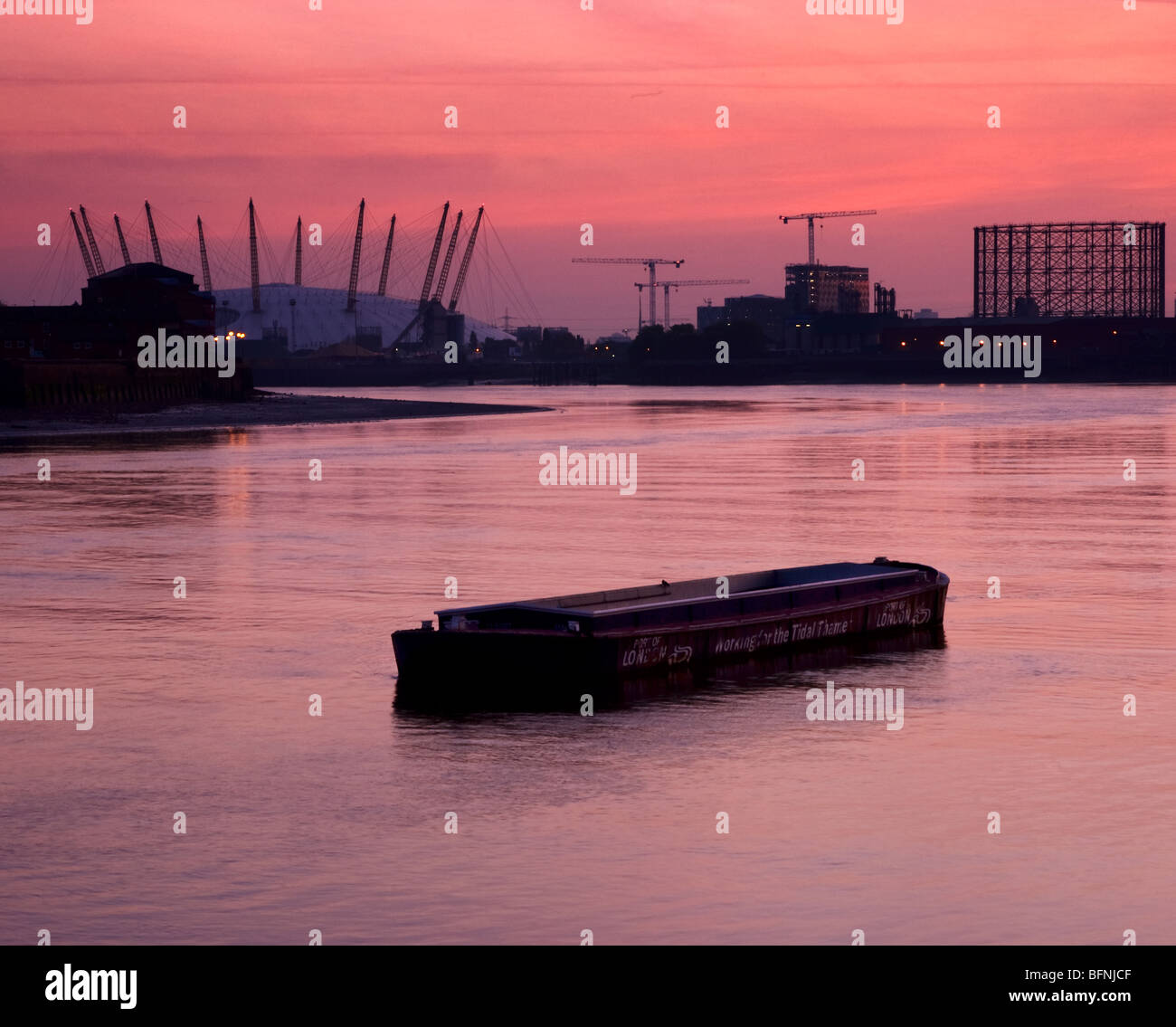 Sunrise image of the O2 Millenium Dome with a very pink sky and river ...