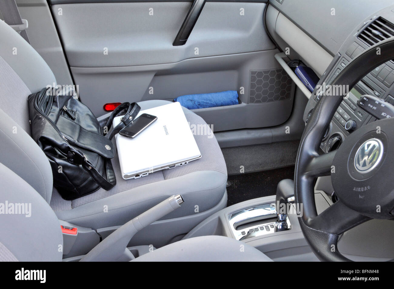 Samsung netbook iPhone & handbag left on passenger seat inside locked ...