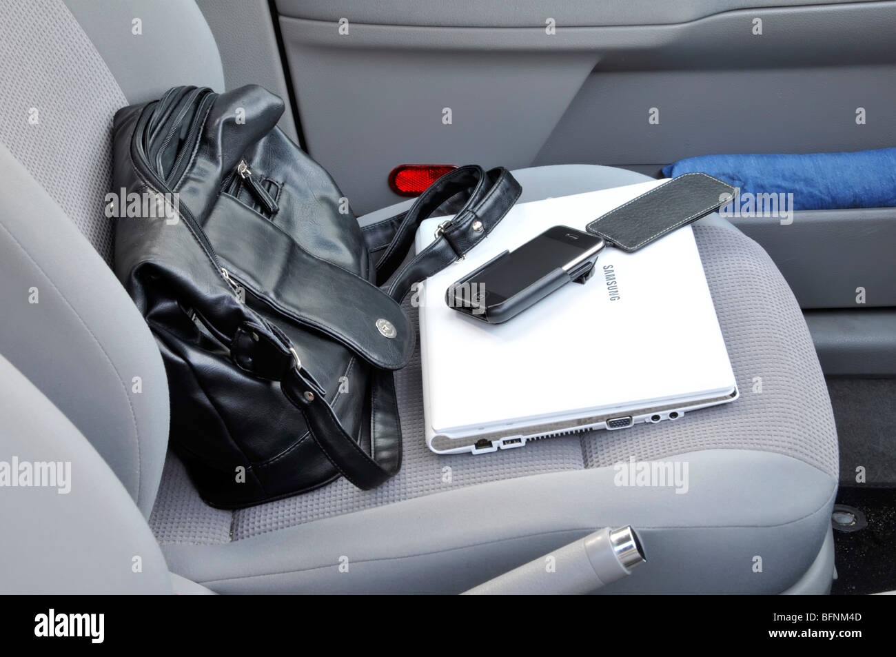 Samsung netbook iPhone & handbag left on passenger seat inside locked ...