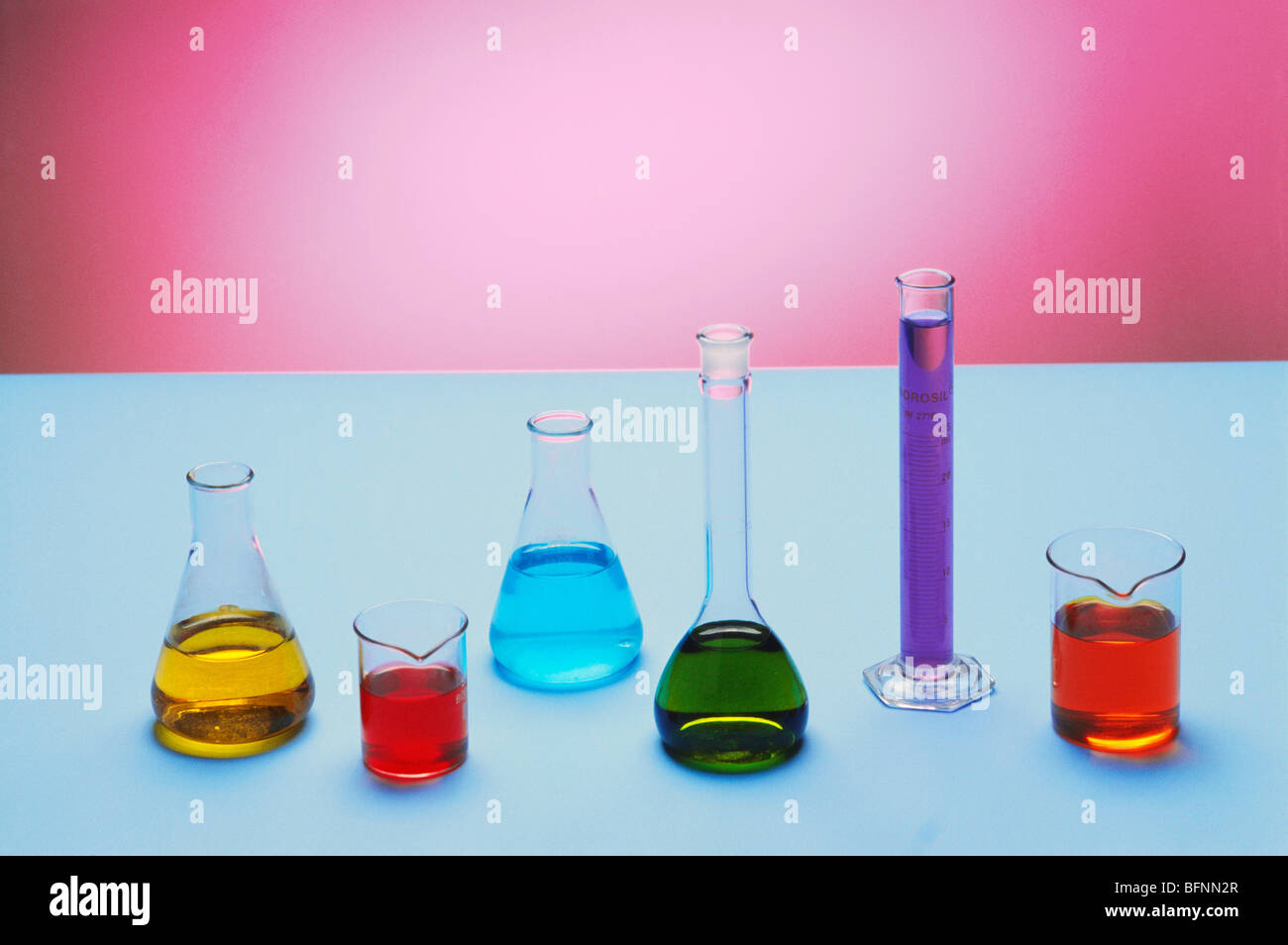 colorful chemicals in laboratory glassware beakers, flask, watch glass ...