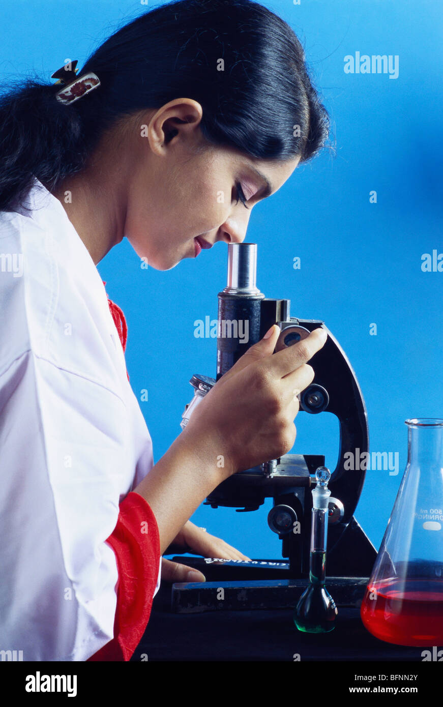 woman looking through microscope ; India ; asia ; MR#579 Stock Photo ...
