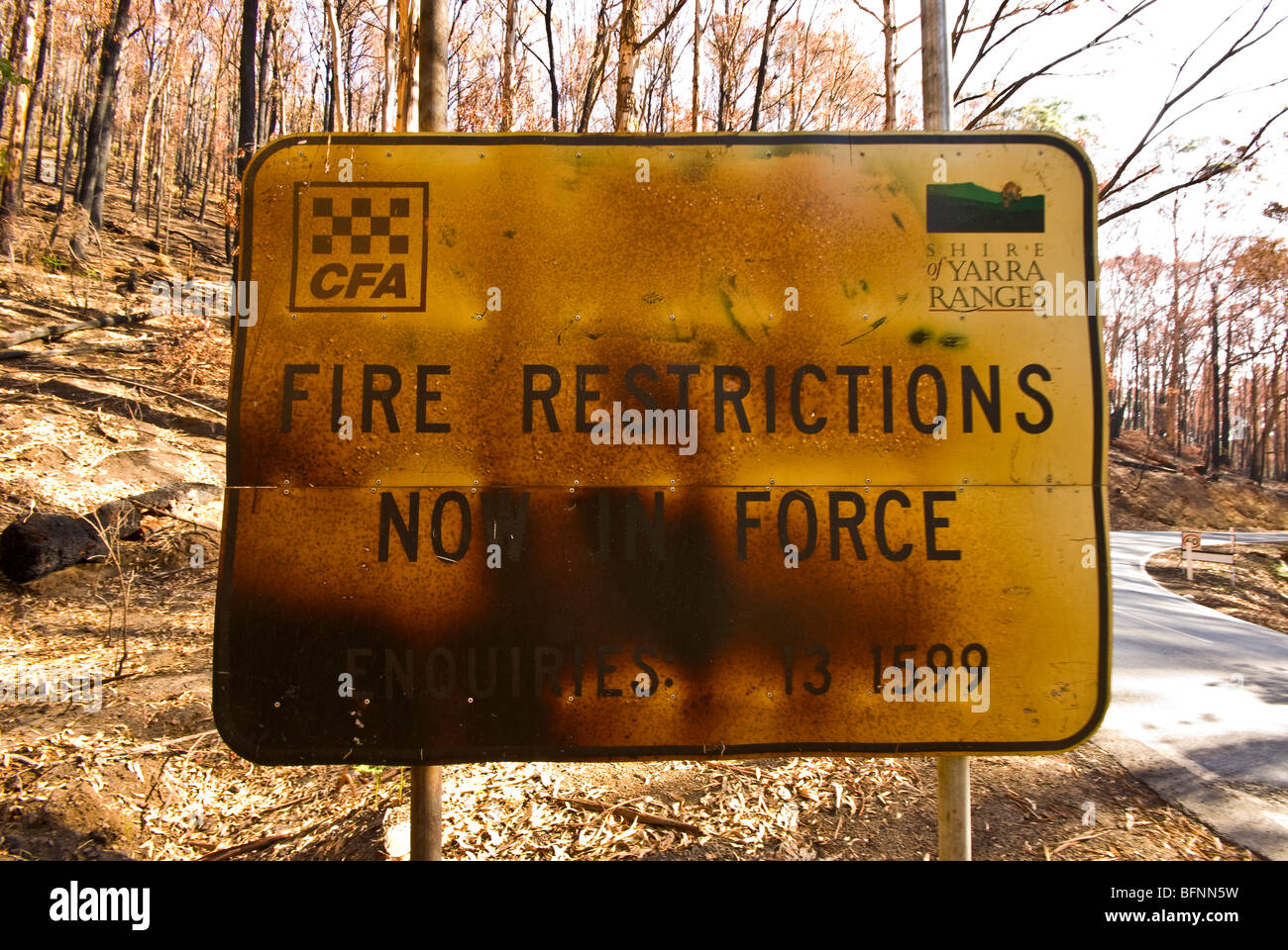 An official fire restriction sign in a national park destroyed by fire ...