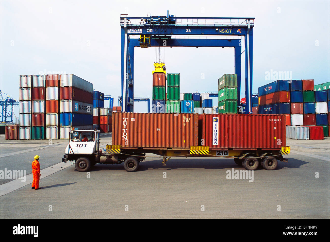 Crane loading container truck at containers yard, Nhava Sheva port ...