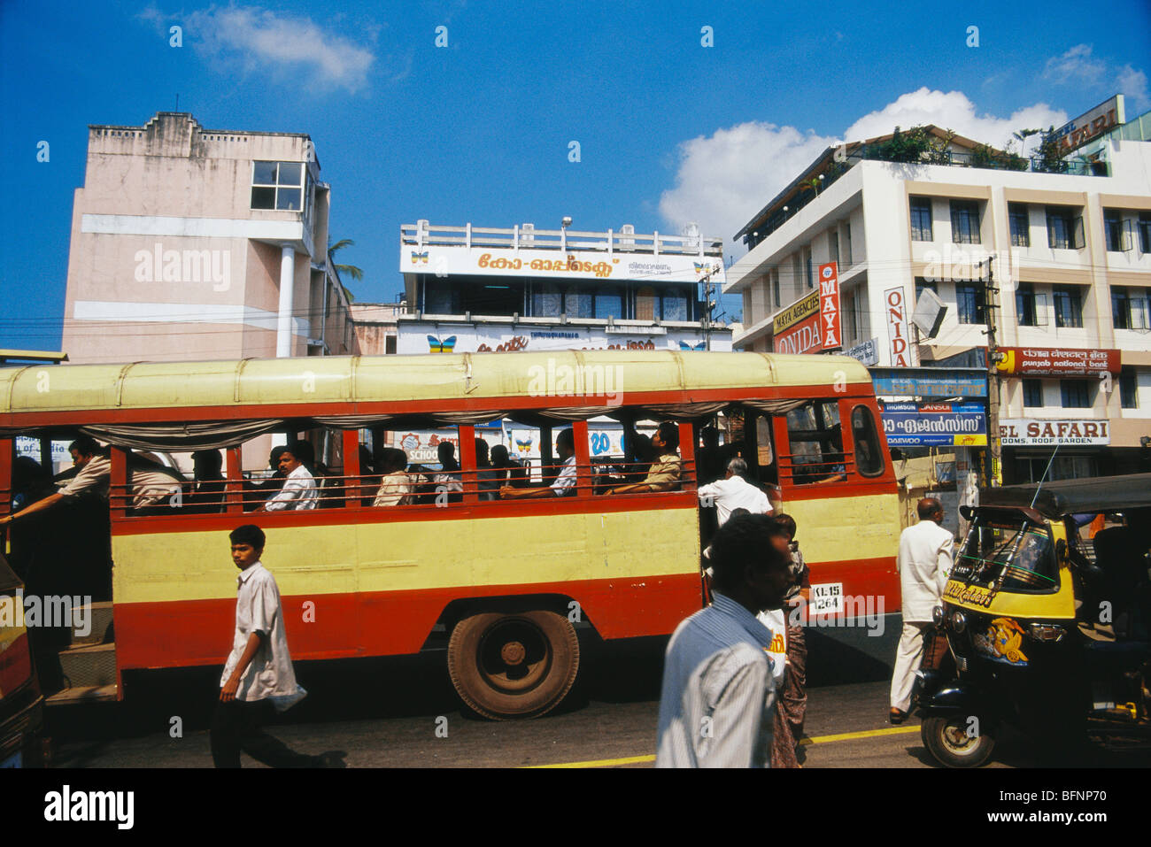 Street traffic bus auto rickshaw ; Trivandrum ; Thiruvananthapuram ...
