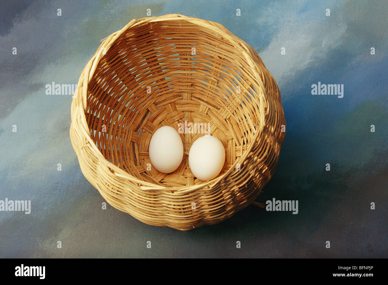 two eggs in cane basket Stock Photo - Alamy