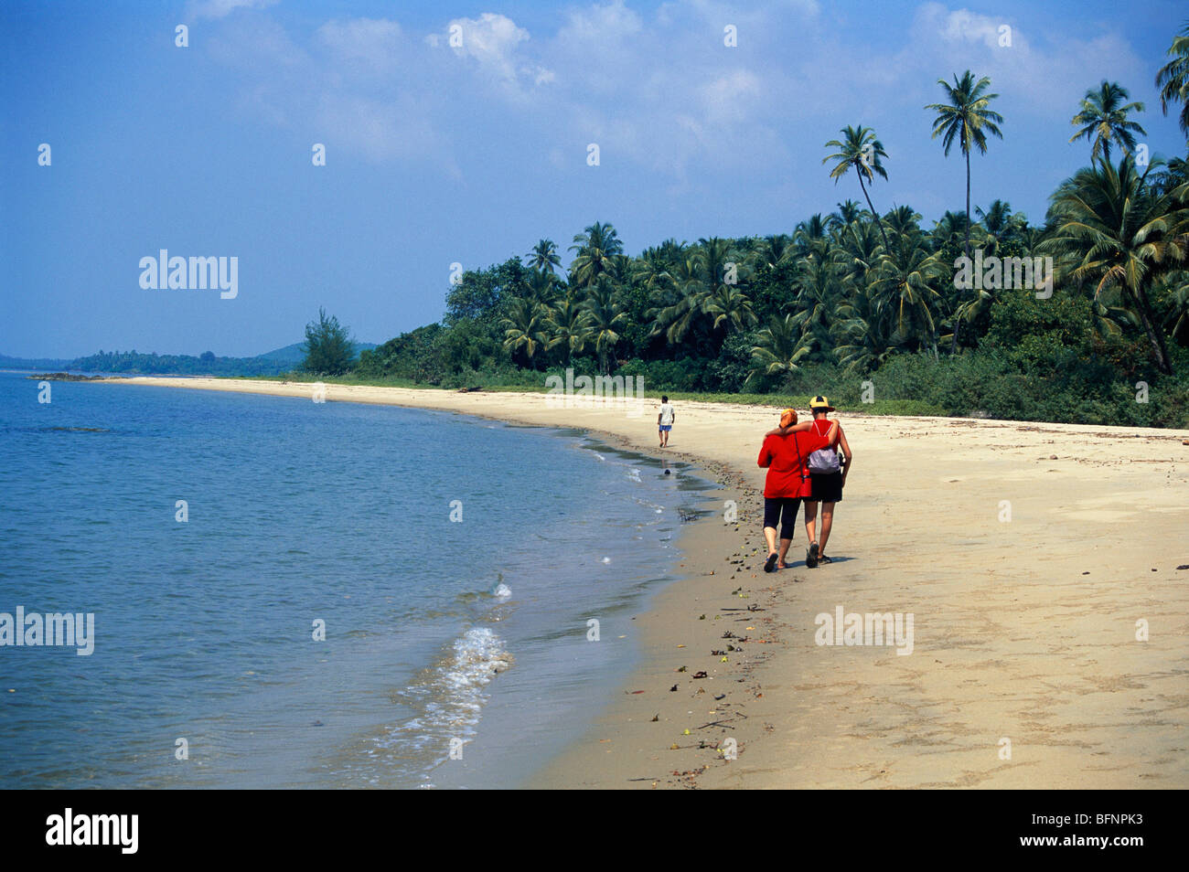 Couple walking on beach ; Devbagh ; Malvan ; Konkan ; Karwar ...