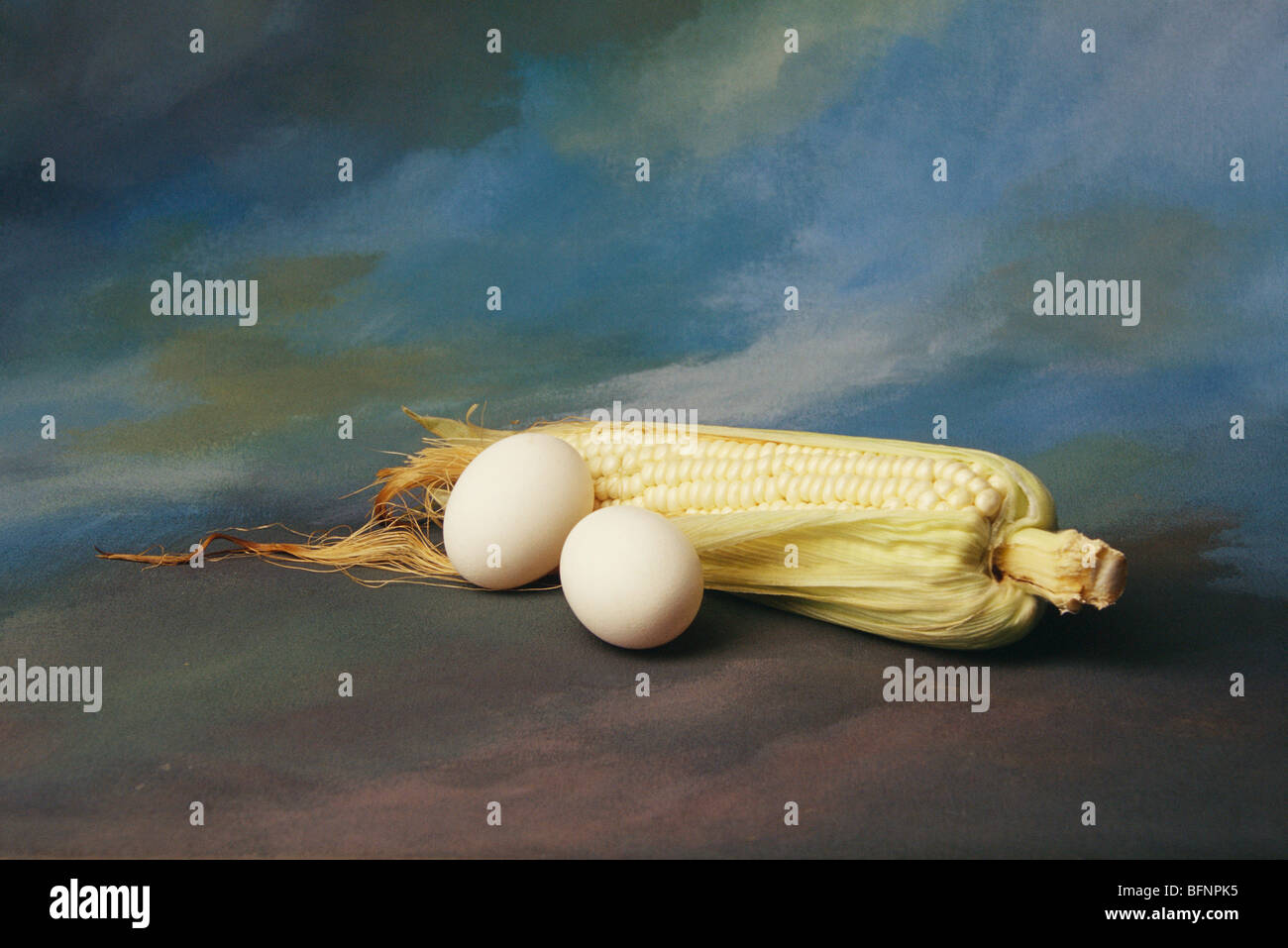 two eggs and maize corn on colorful background Stock Photo - Alamy