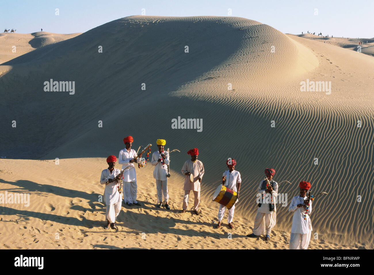 Rajasthani musicians playing music in sam sand dunes ; Thar desert ...