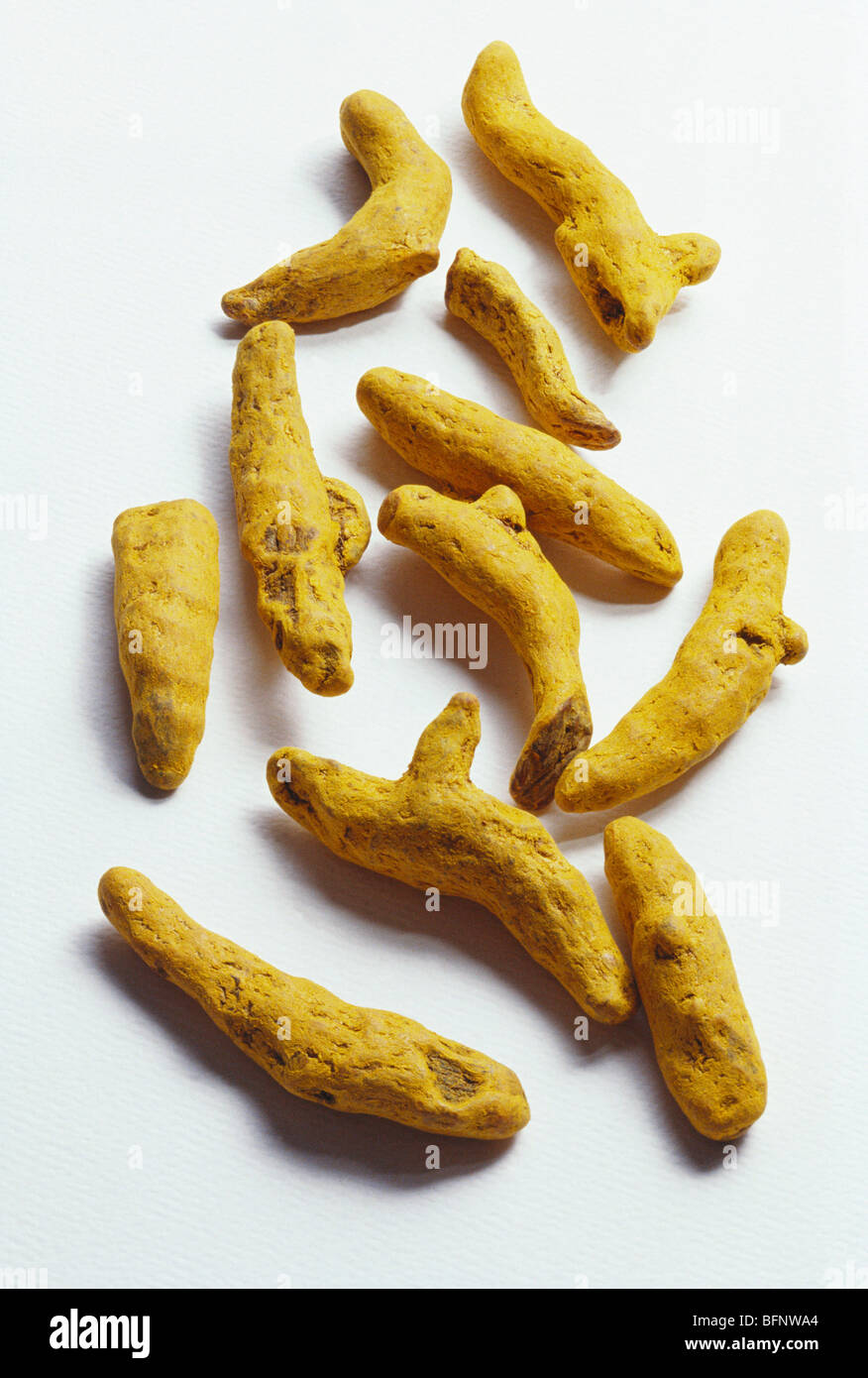 turmeric roots on white background Stock Photo - Alamy
