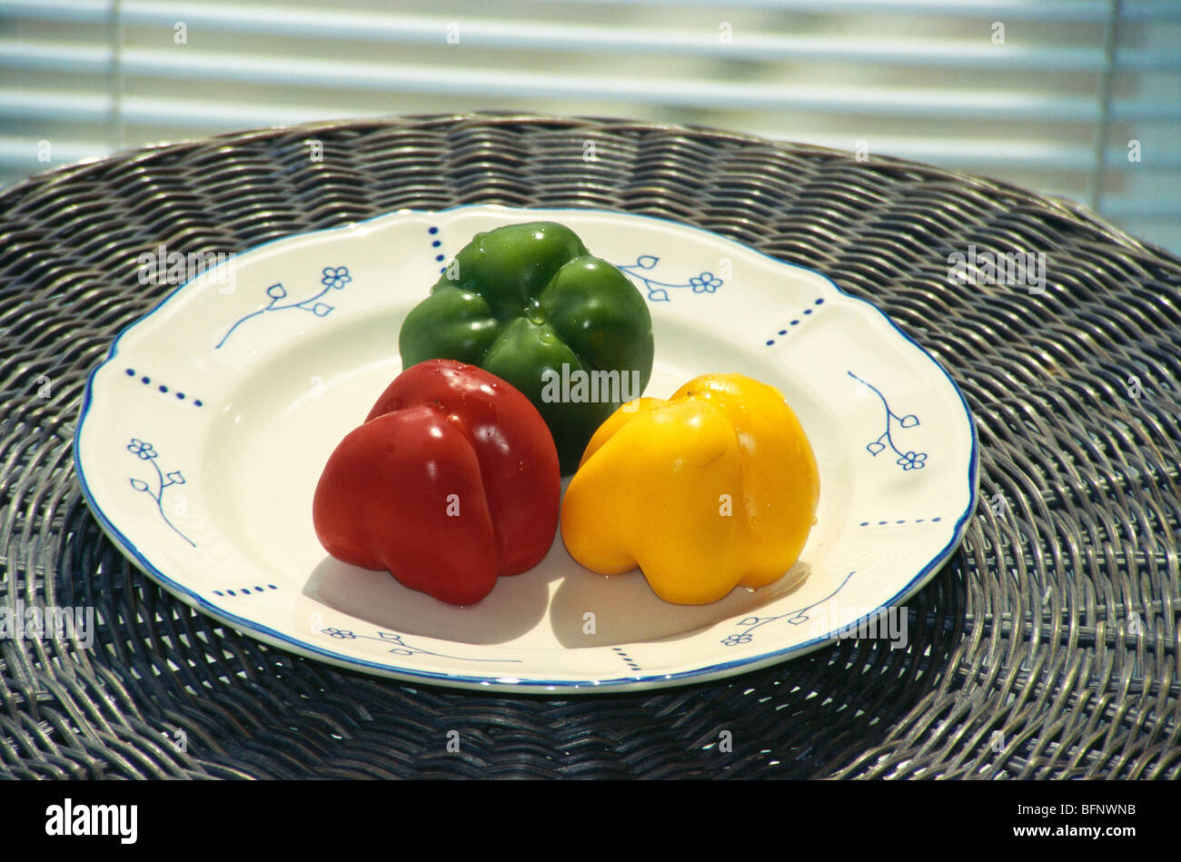 colorful capsicum red green yellow in plate Stock Photo - Alamy