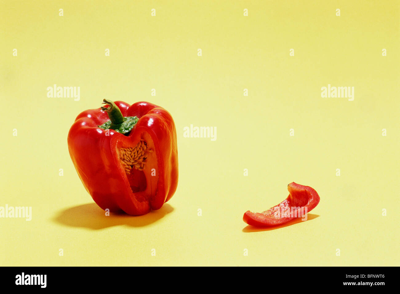 SSK 61690 : Vegetable ; red cut capsicum with slice on yellow ...
