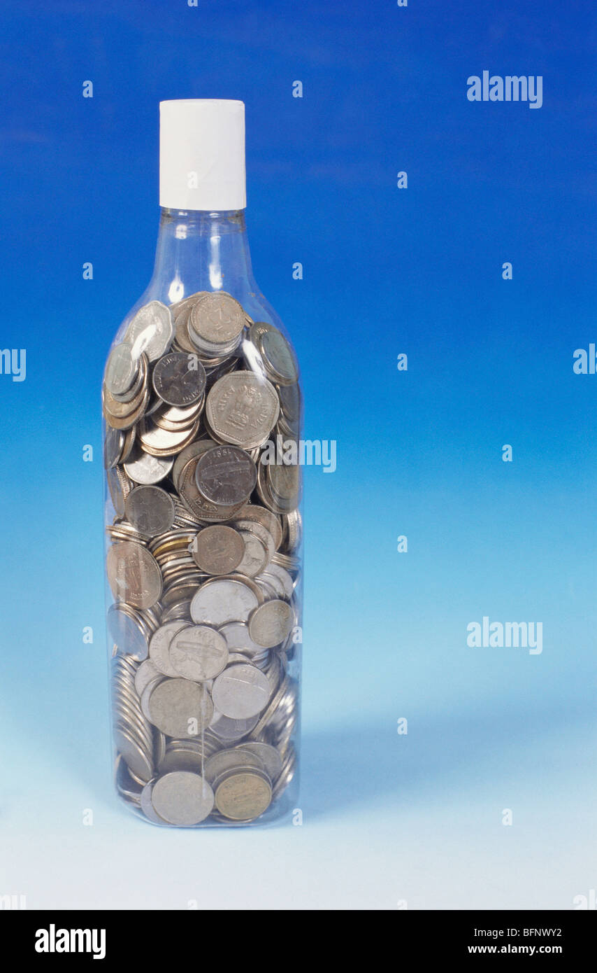 coins in glass bottle Stock Photo - Alamy