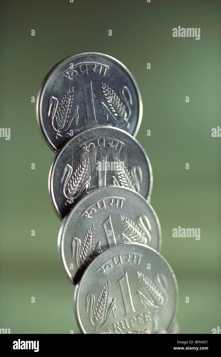growth ; Indian one rupees coins on green background Stock Photo - Alamy