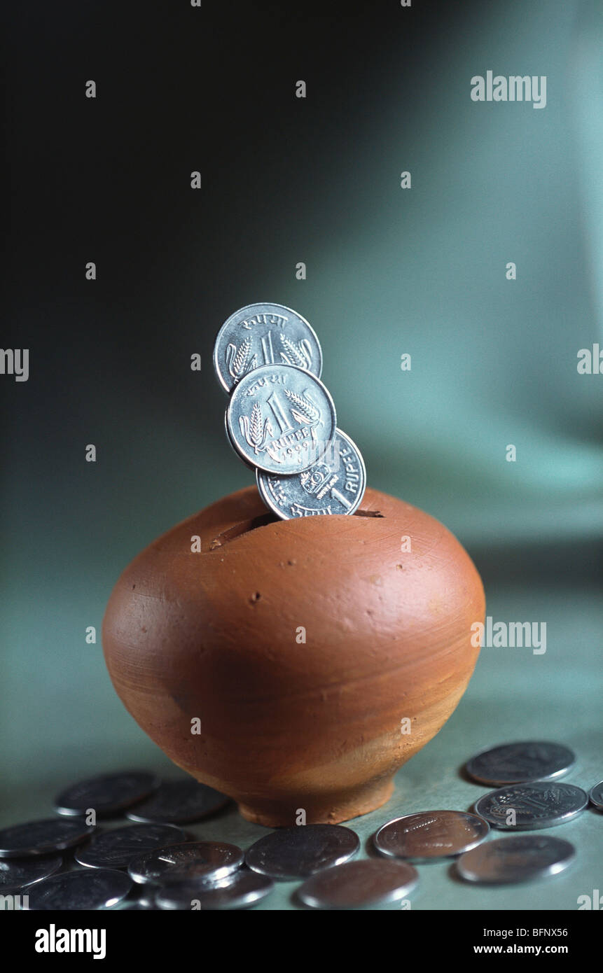 savings ; piggy bank ; penny bank ; money box ; green background Stock ...