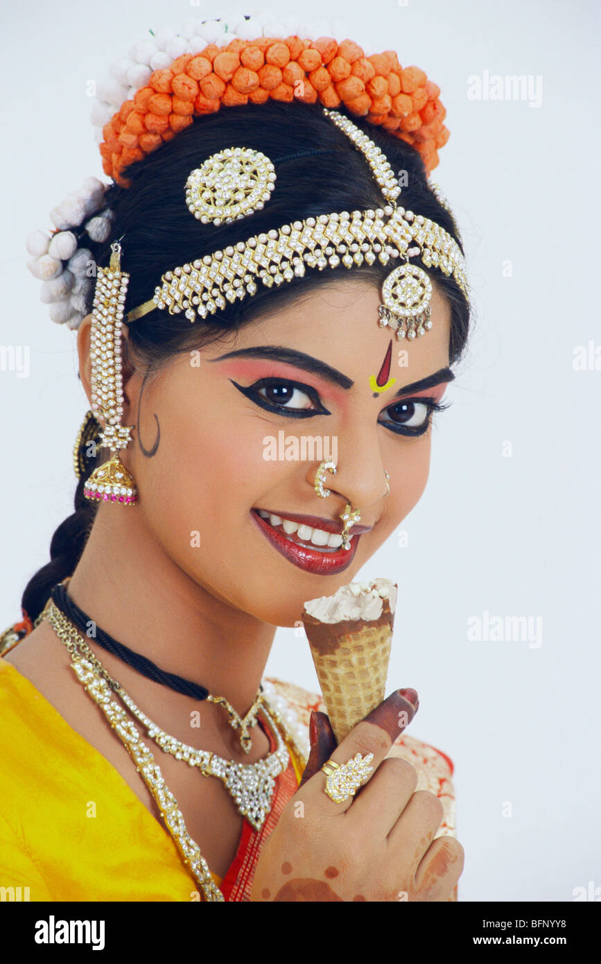 Indian woman eating ice cream ; India ; asia ; MR#579 Stock Photo - Alamy