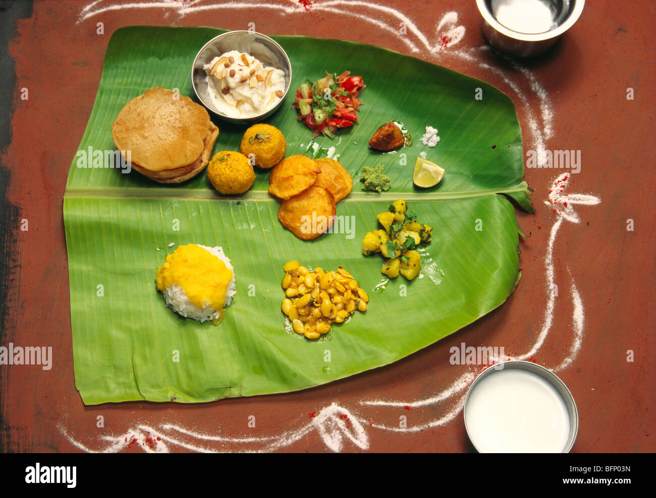 ADC 62178 : Traditional Indian meal rice puri curds fried potato ...