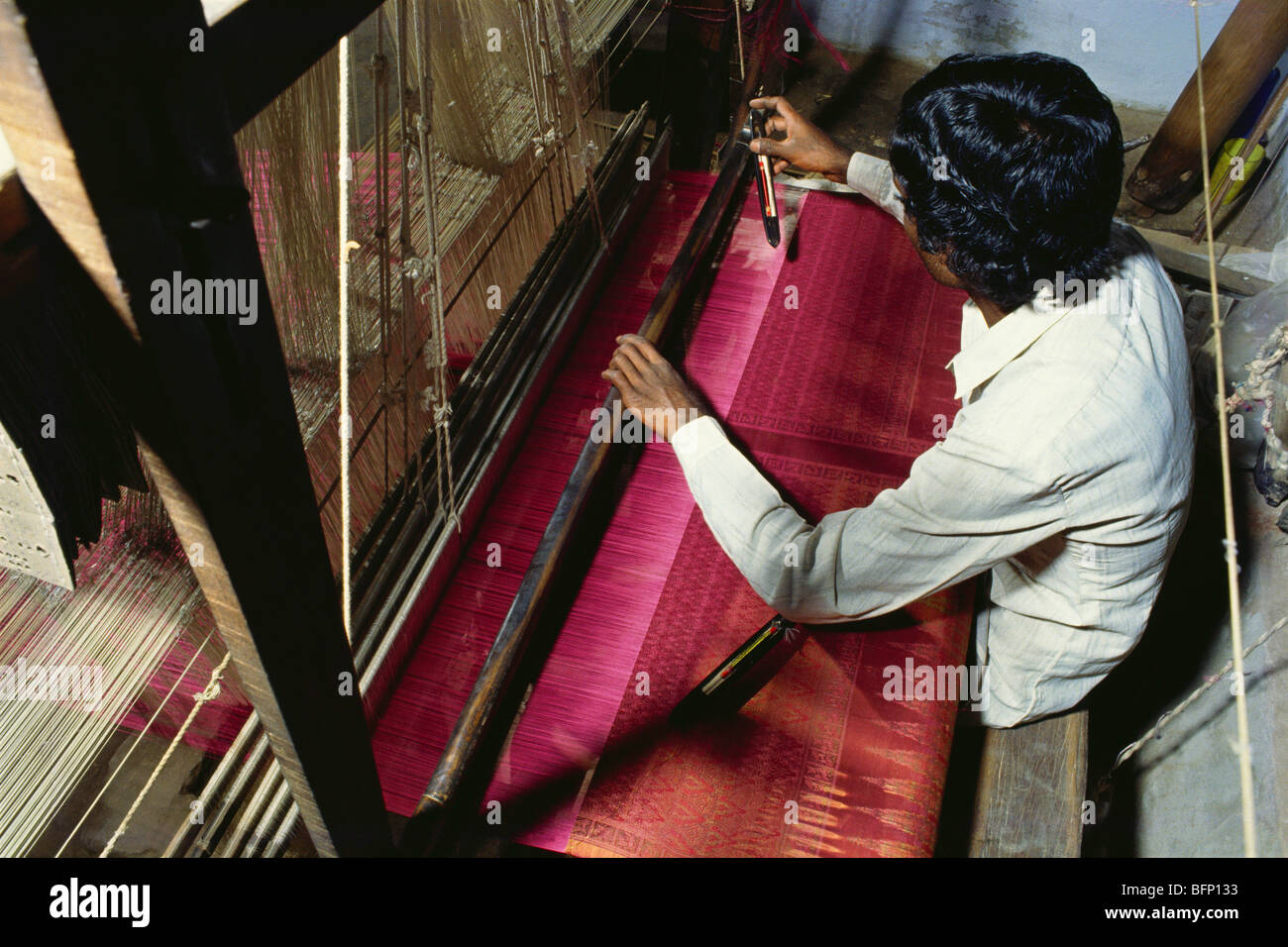man weaving handloom sari ; Banaras ; Varanasi ; Uttar Pradesh ; India ...