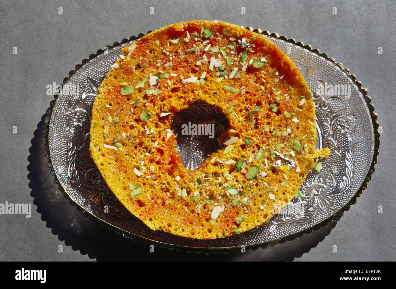 Ghevar sweets hi-res stock photography and images - Alamy