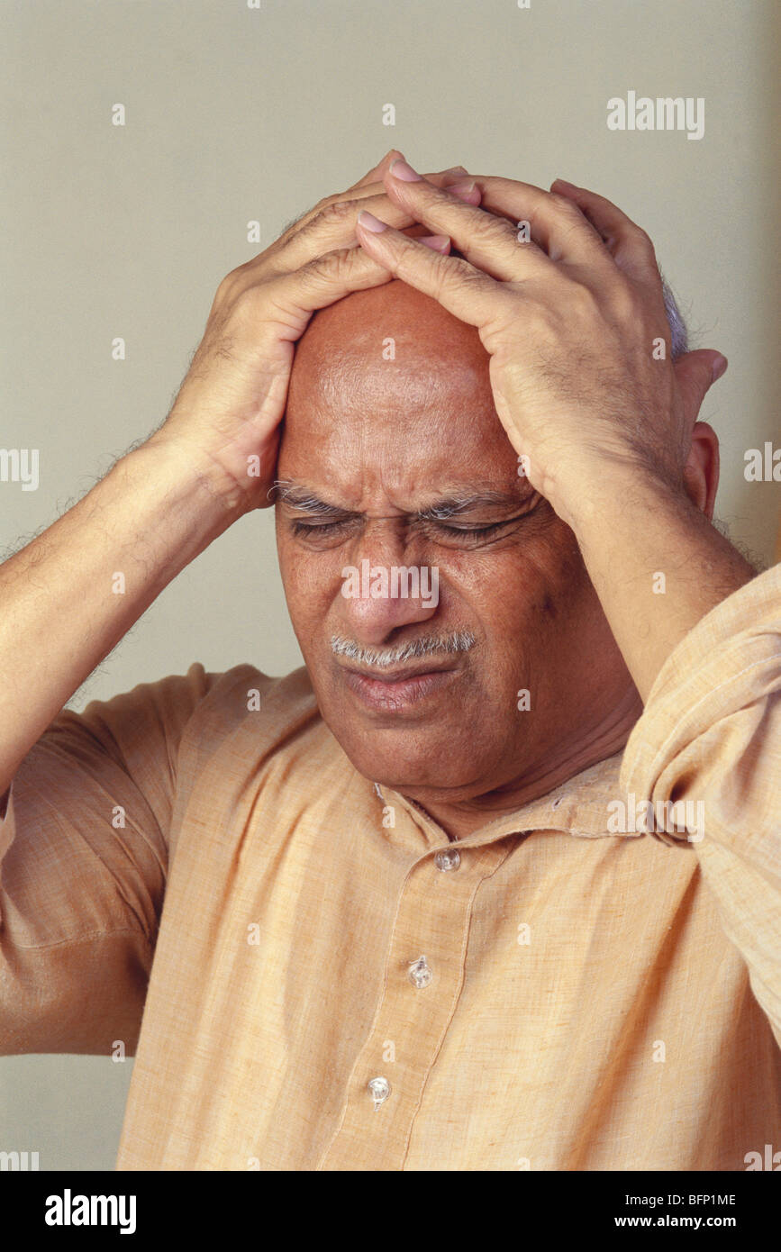 Man pressing his head suffering headache ; India ; asia ; MR#176 Stock ...