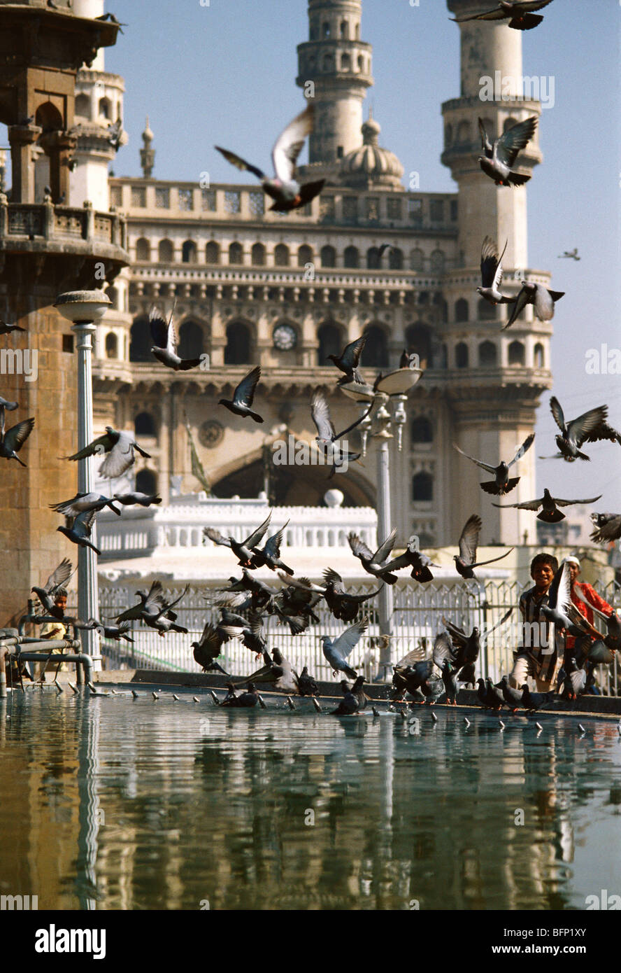 Charminar birds flying ; Hyderabad ; Andhra Pradesh ; Telengana ; India ...