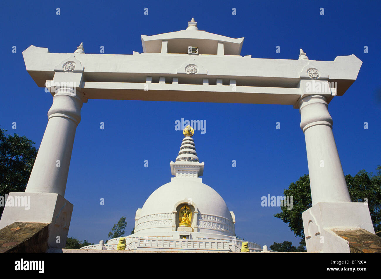 Vishwa Shanti Stupa through decorated entrance arch ; Rajgir ; Bihar ...