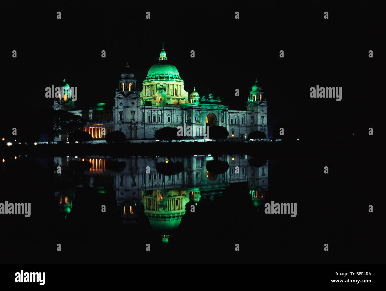 Victoria Memorial reflection in pond at night ; Calcutta ; Kolkata ...