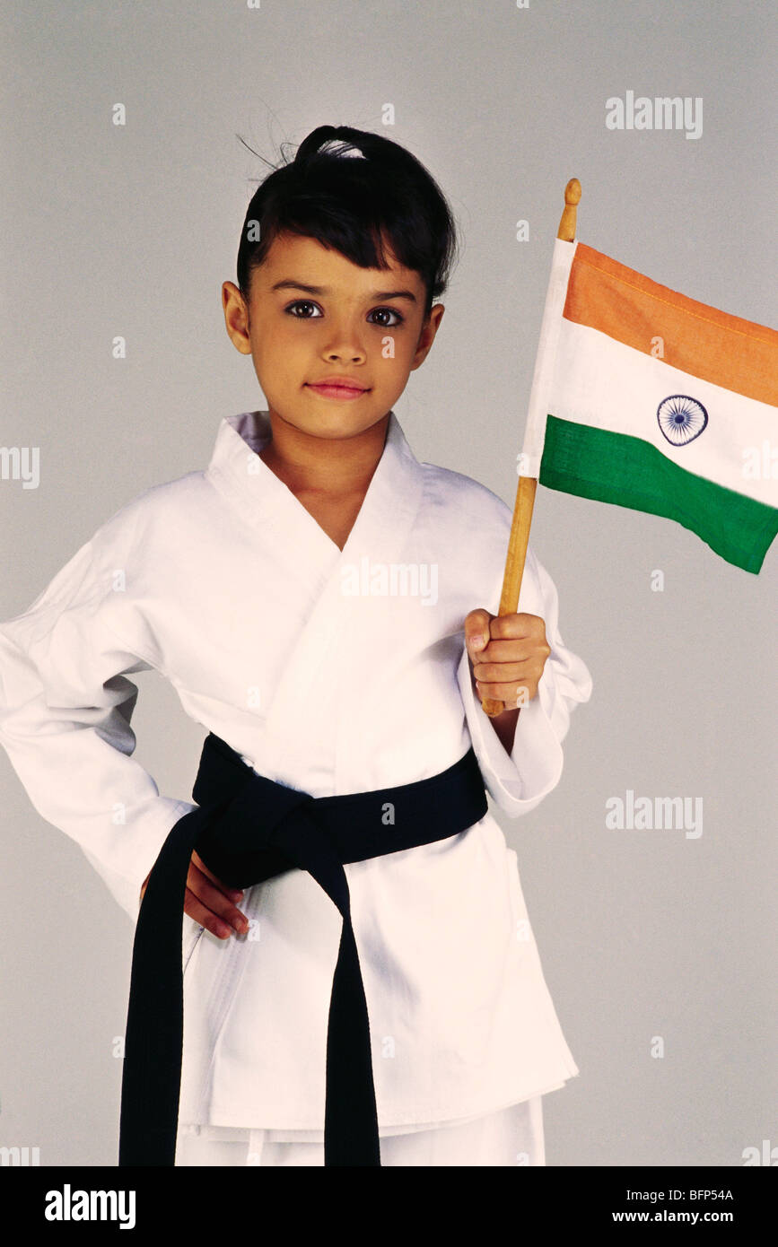 VDA 63756 : Girl dressed as karate player holding flag of India in hand ...