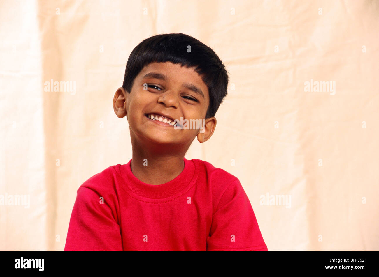 Indian child boy smiling showing teeth ; india ; asia ; MR Stock Photo ...