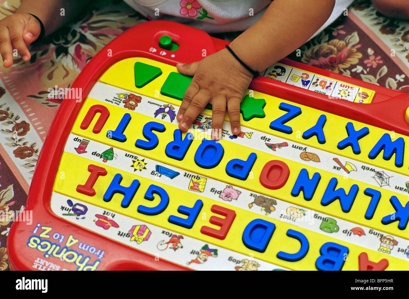 Indian baby learning alphabets ABCD ; India ; Asia ; MR#152 Stock Photo ...