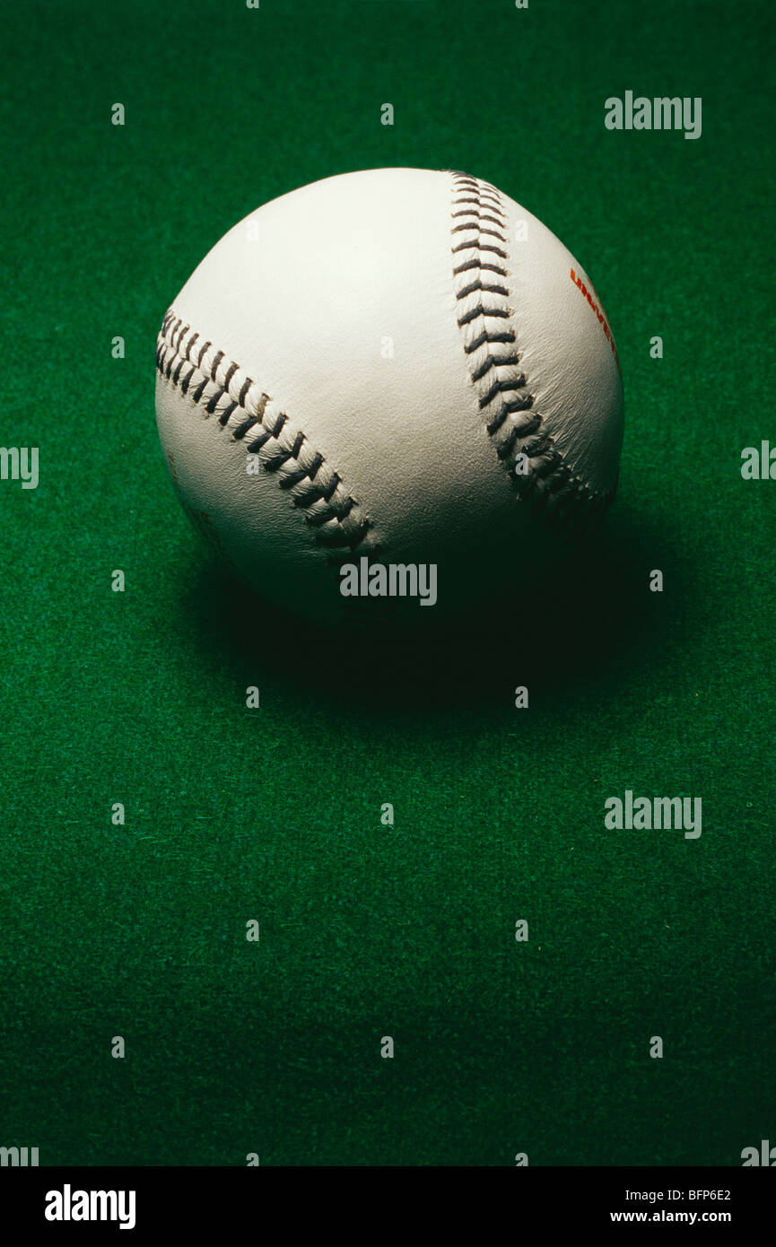 Baseball on green background Stock Photo - Alamy
