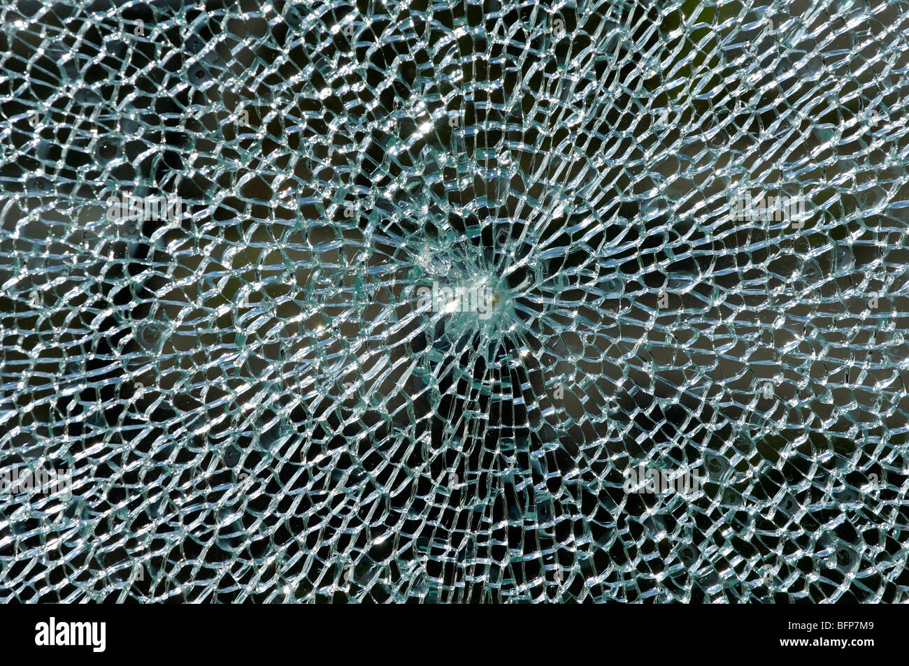 Broken glass screen caused by criminal damage Stock Photo - Alamy