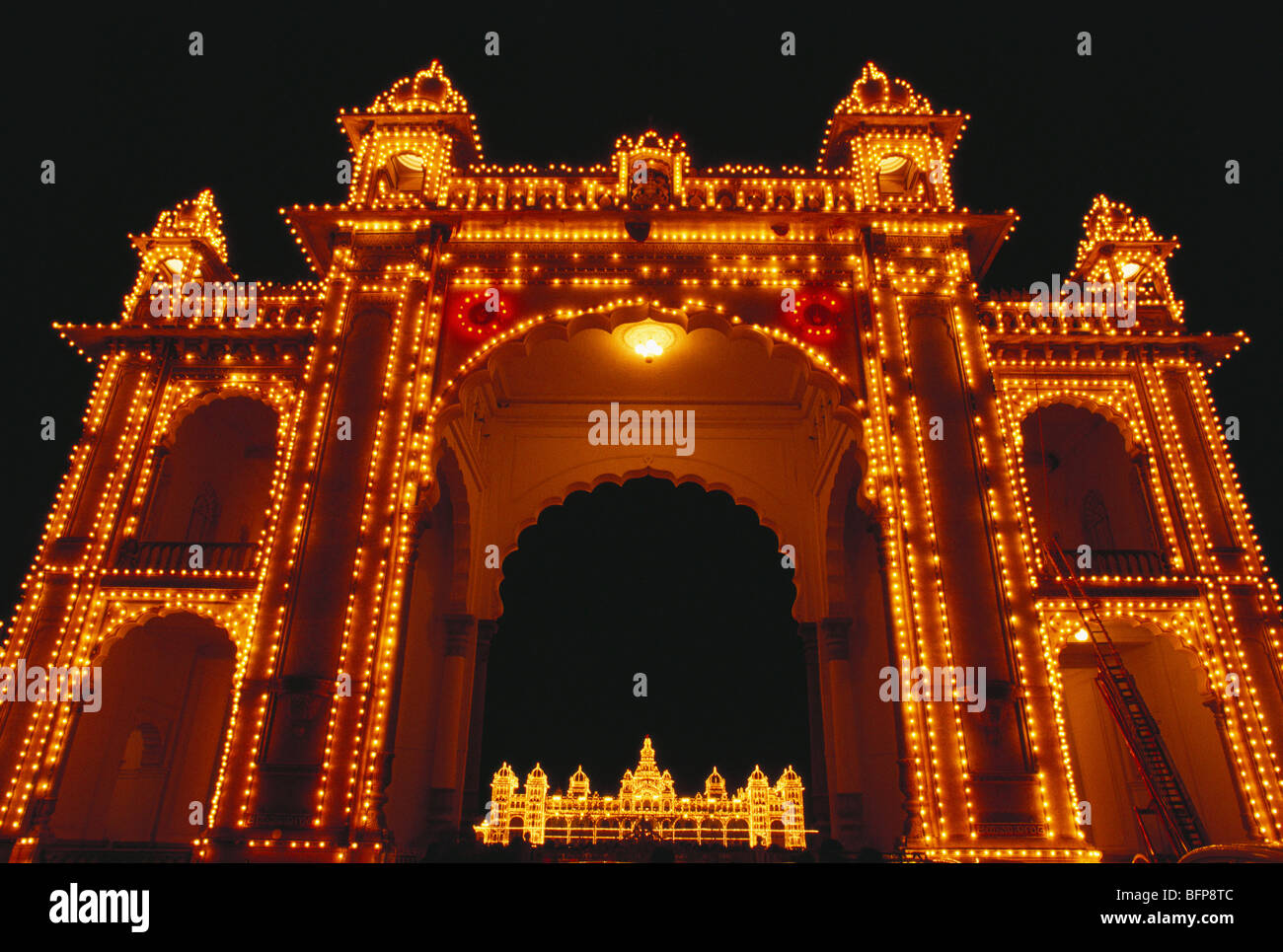 Mysore Palace through illuminated entrance gate ; Mysore ; Mysuru ...