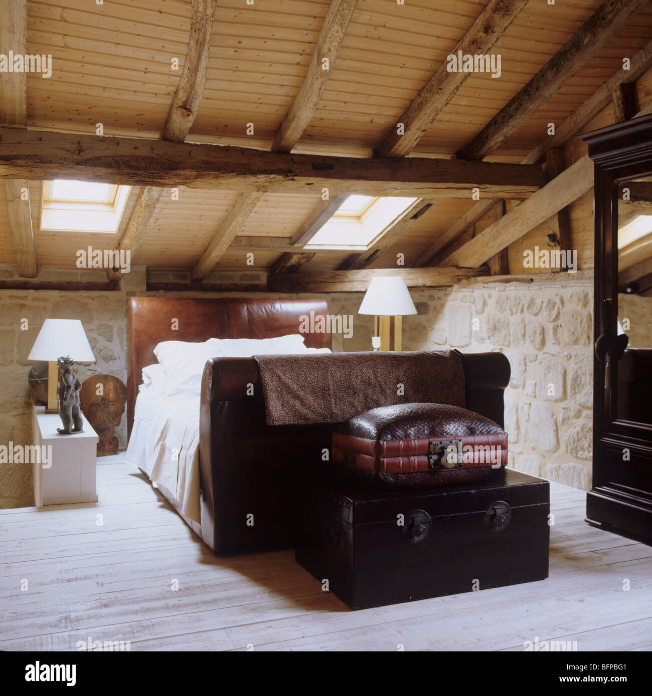 Bedroom in 17th century barn renovation with original oak rafters Stock ...