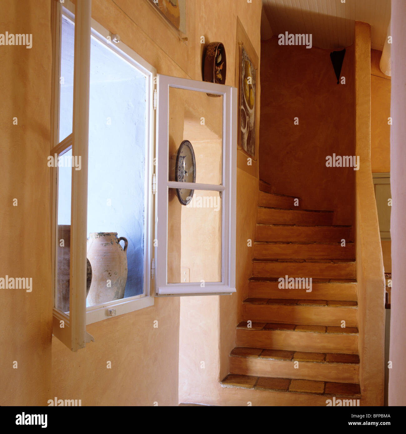 Terracotta staircase and open window in Provençal farmhouse Stock Photo ...