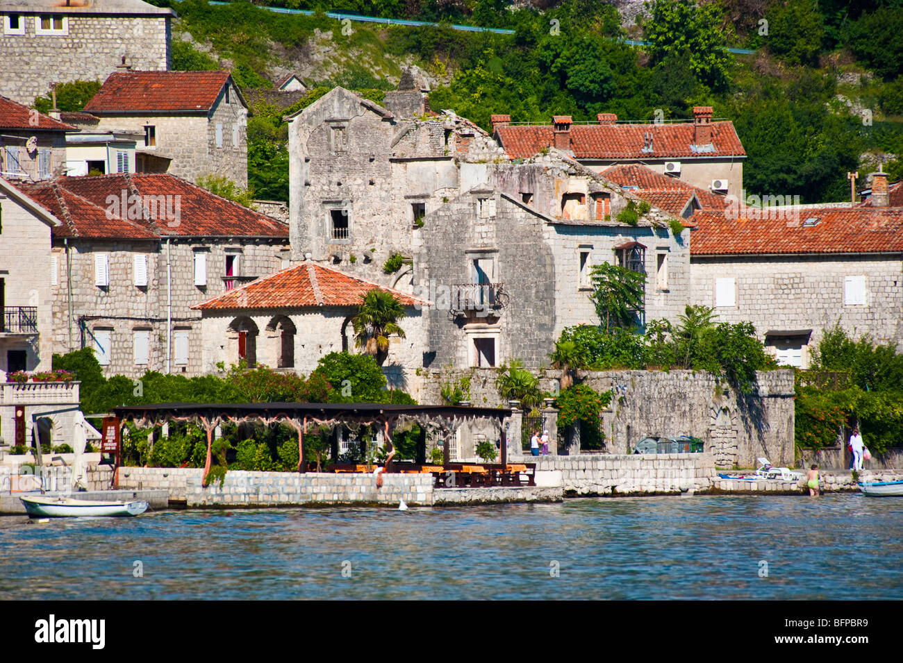 Restaurant and facades in historic city of Perast, Risan Bay, Bay of ...