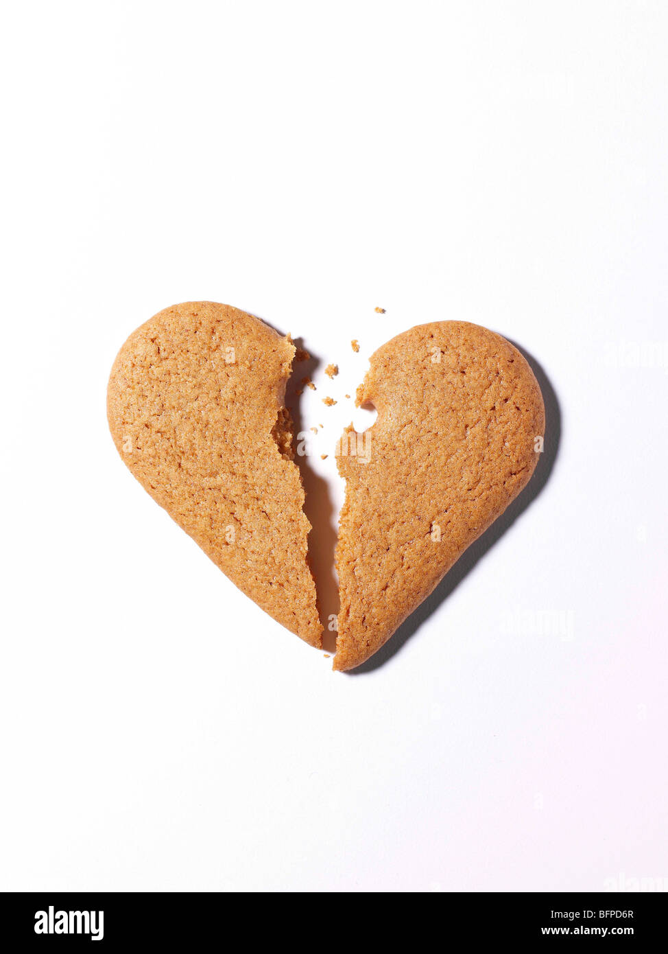 Broken Gingerbread Heart on white background Stock Photo - Alamy