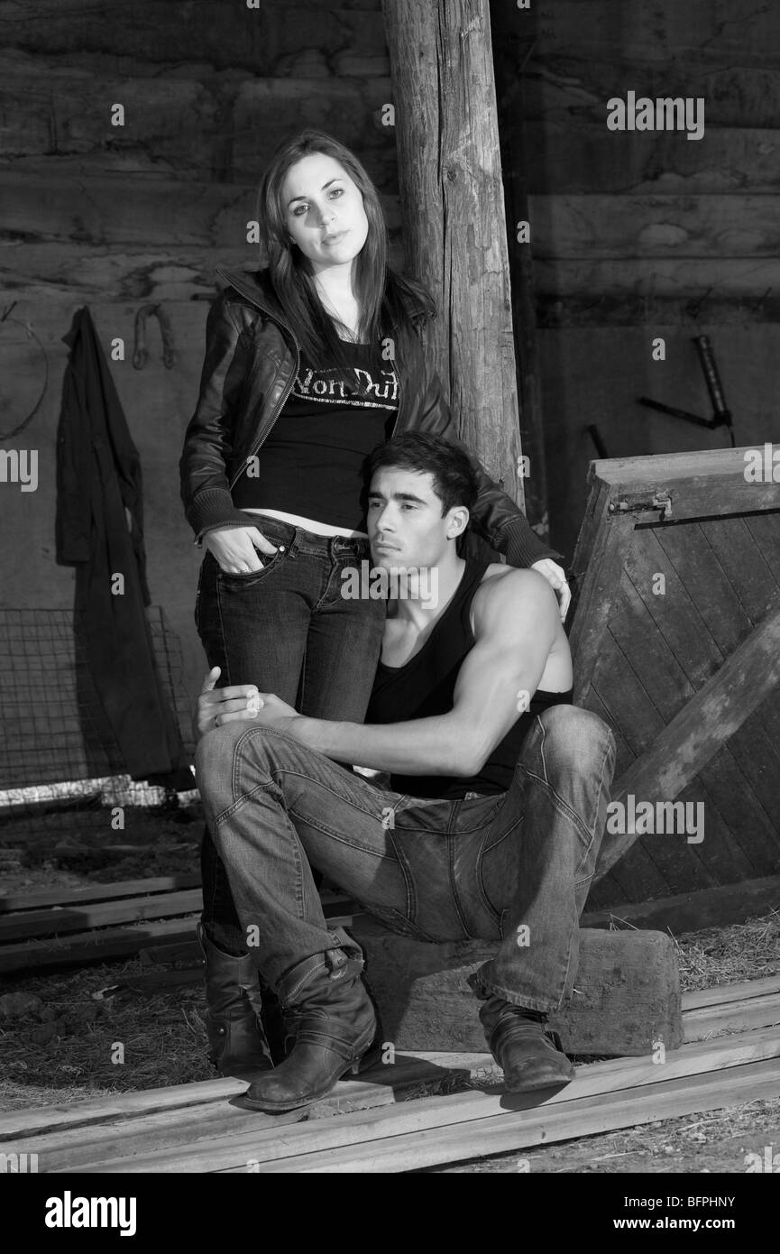 Attractive young couple in a barn Stock Photo - Alamy