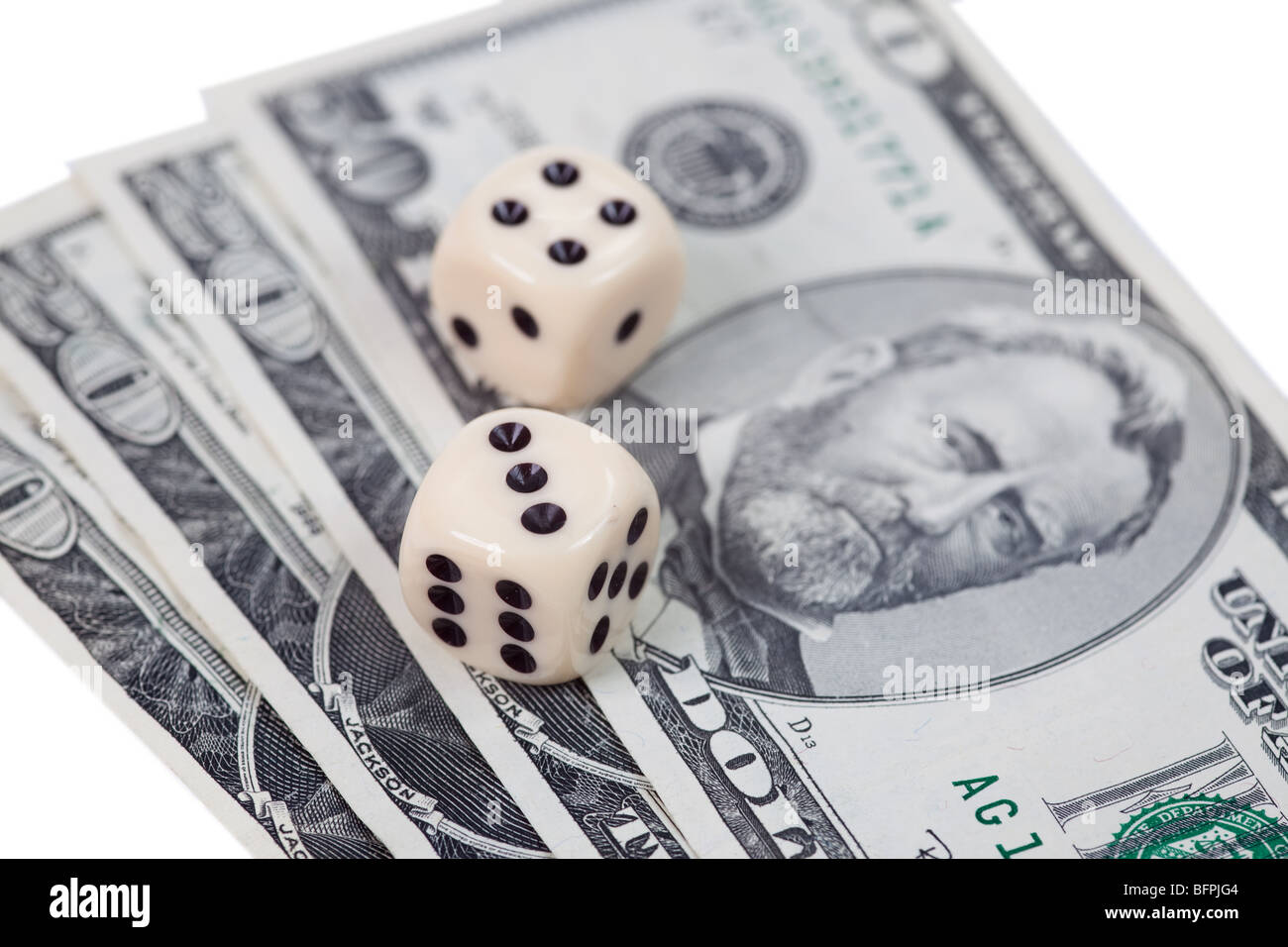 the dice on american money Stock Photo - Alamy