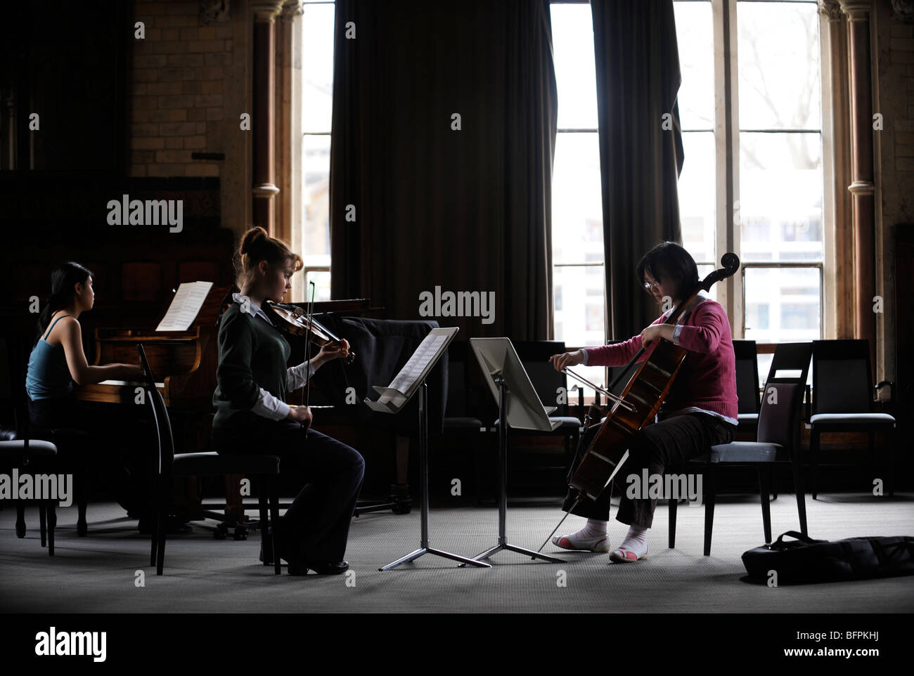 Girls from Cheltenham Ladies' College practise playing their piano ...